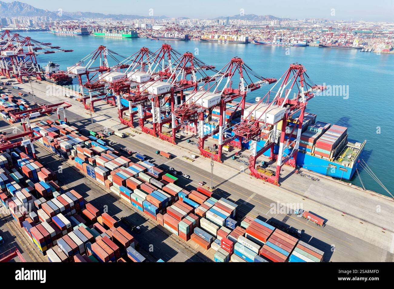 QINGDAO, CHINA - JANUARY 29, 2025 - Cargo ships load and unload foreign trade containers at the ...