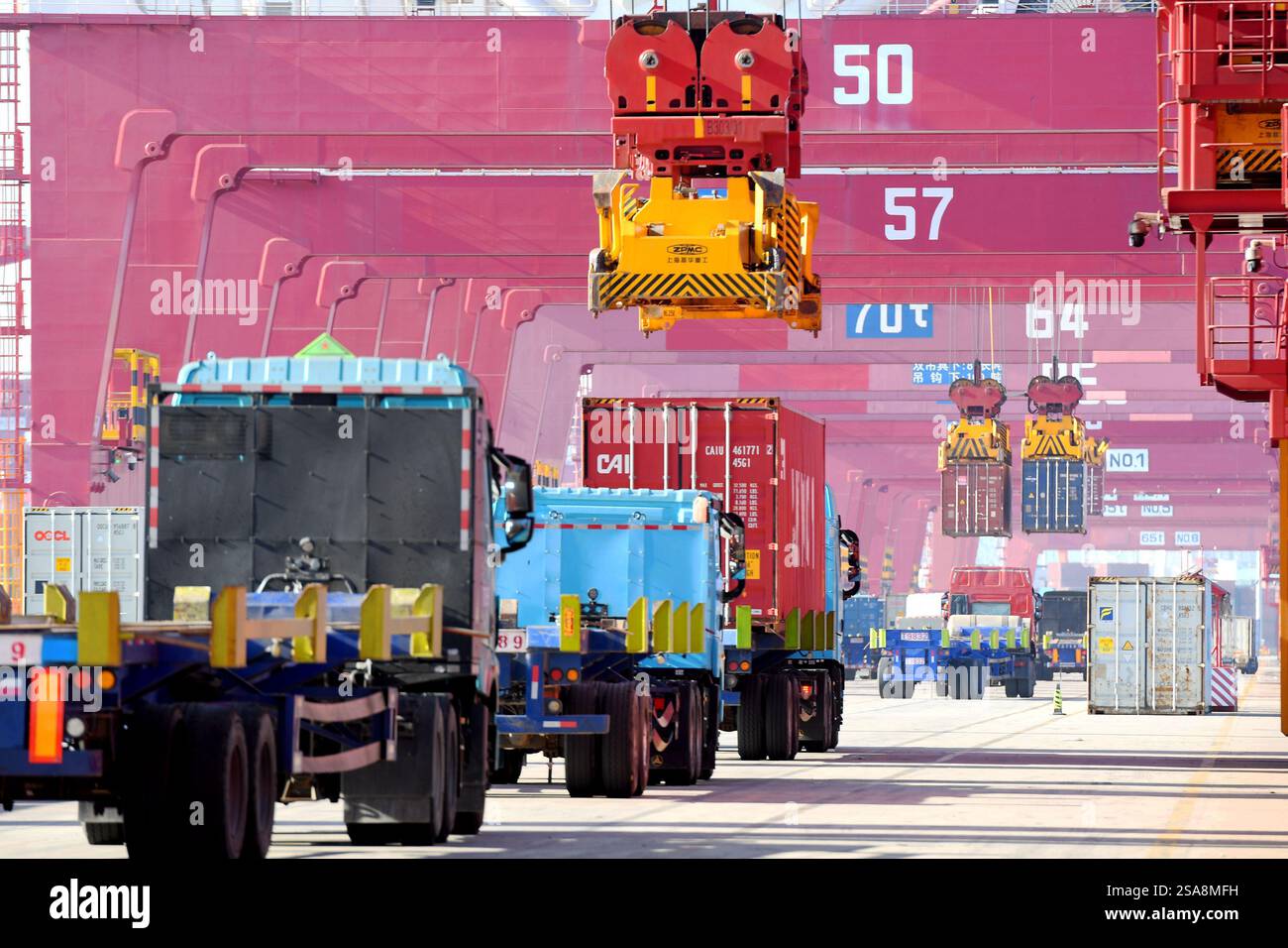 QINGDAO, CHINA - JANUARY 29, 2025 - Cargo ships load and unload foreign trade containers at the ...