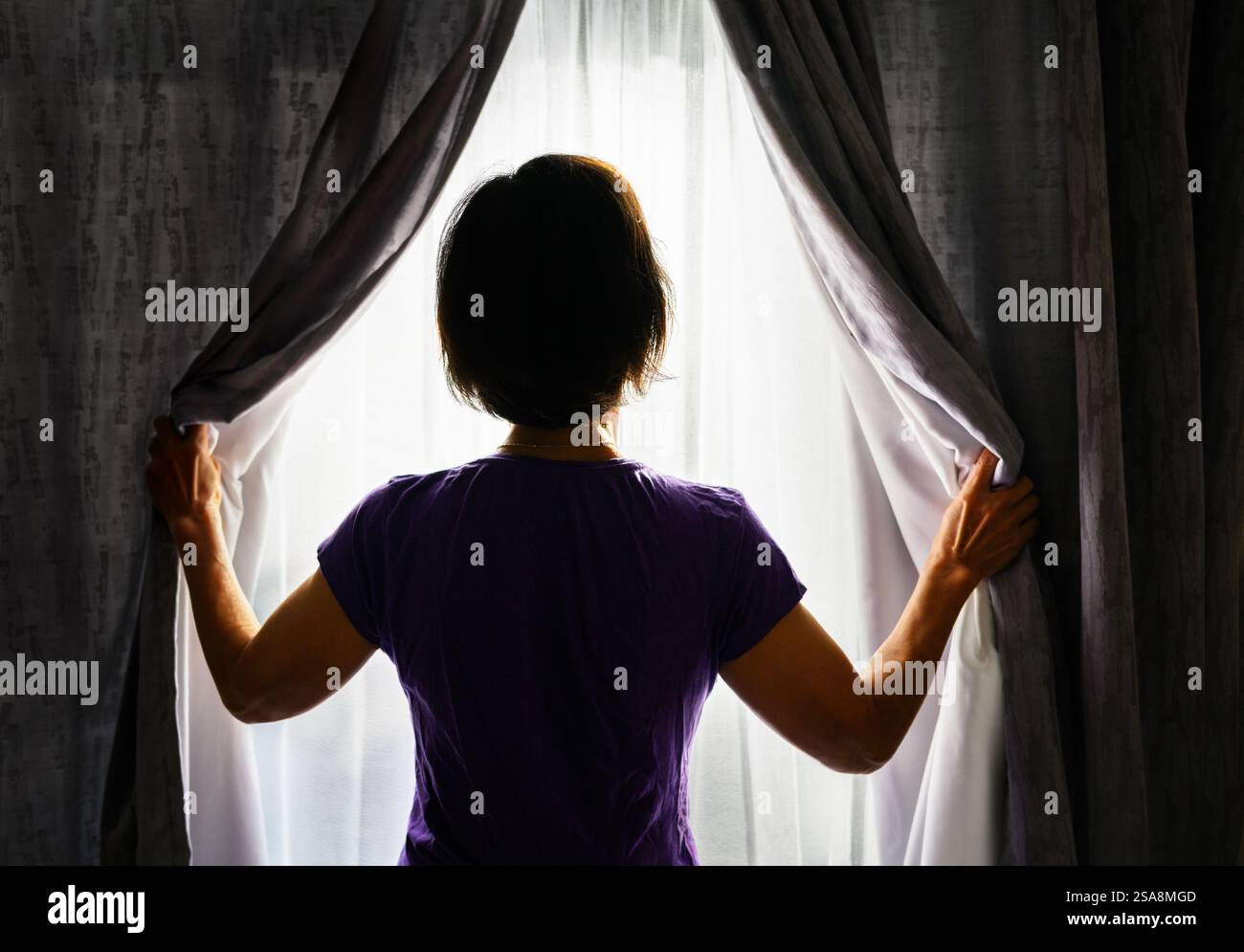 Woman opening curtains let hi-res stock photography and images - Alamy