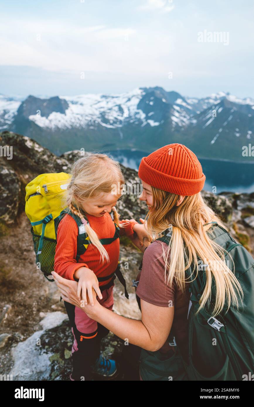Mother hiking with daughter in mountains outdoor together family ...