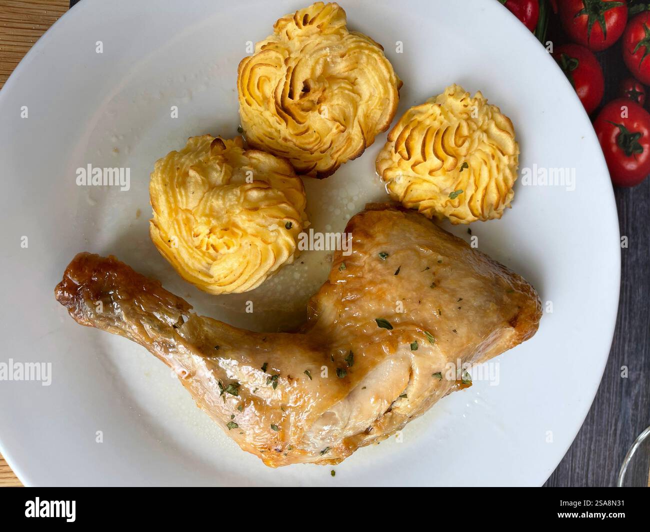 Roasted chicken with duchess potatoes Stock Photo - Alamy