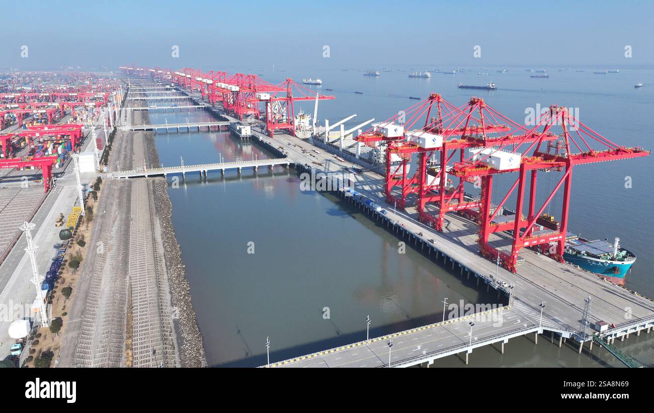 SUZHOU, CHINA - JANUARY 29, 2025 - Cargo ships load and unload ...