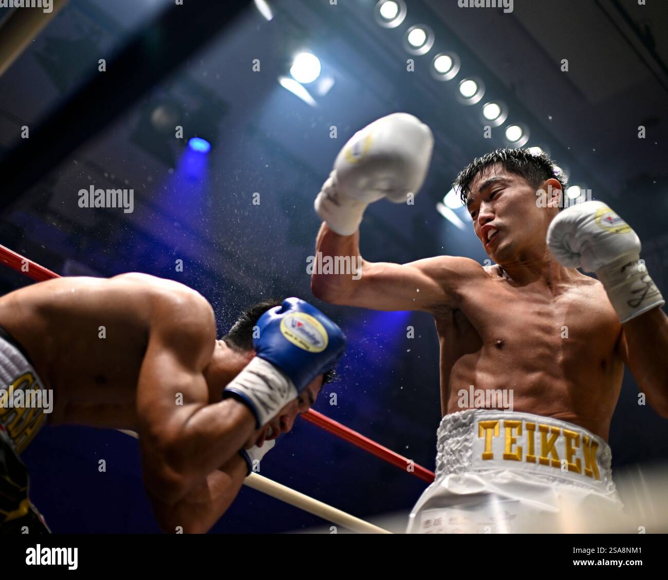 Champion Kenji Fujita (withe gloves) of Japan and challenger Michael ...