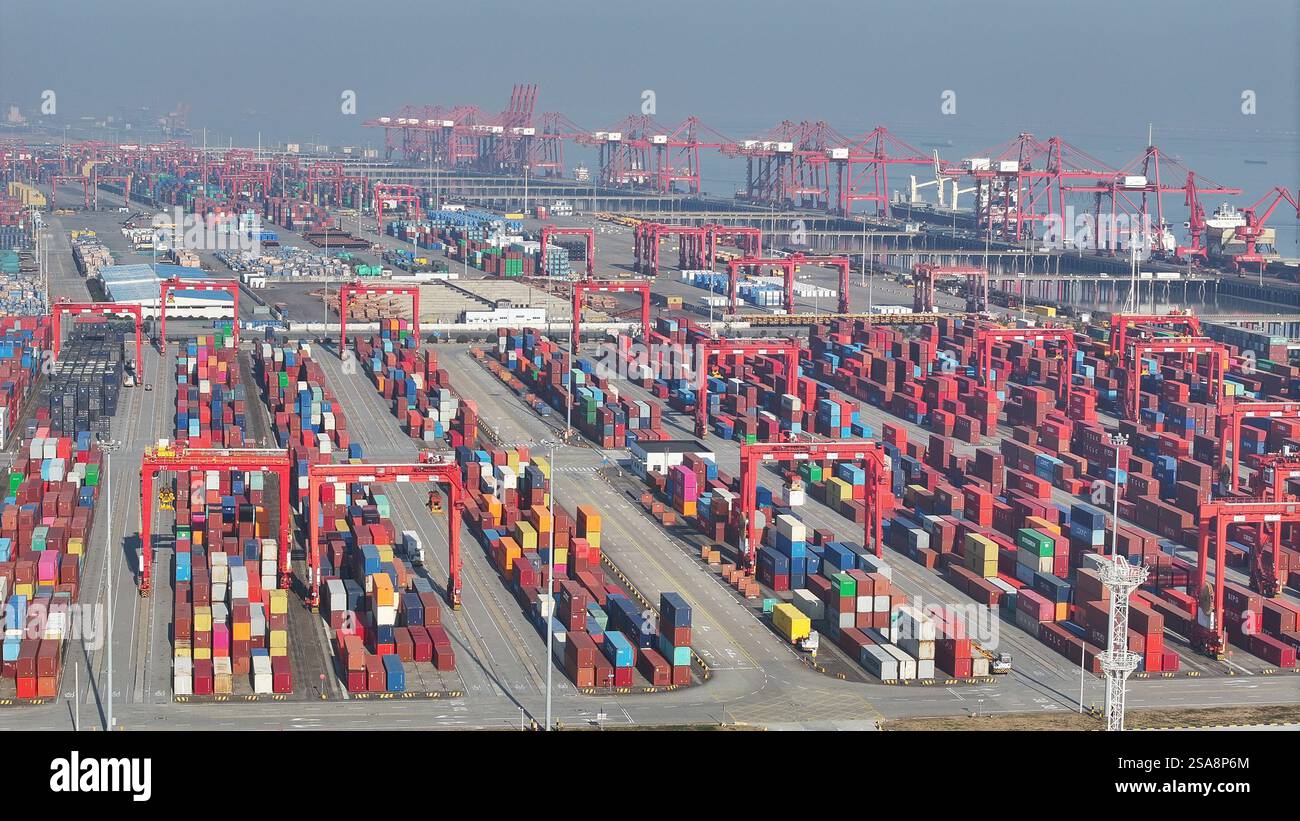 SUZHOU, CHINA - JANUARY 29, 2025 - Cargo ships load and unload ...