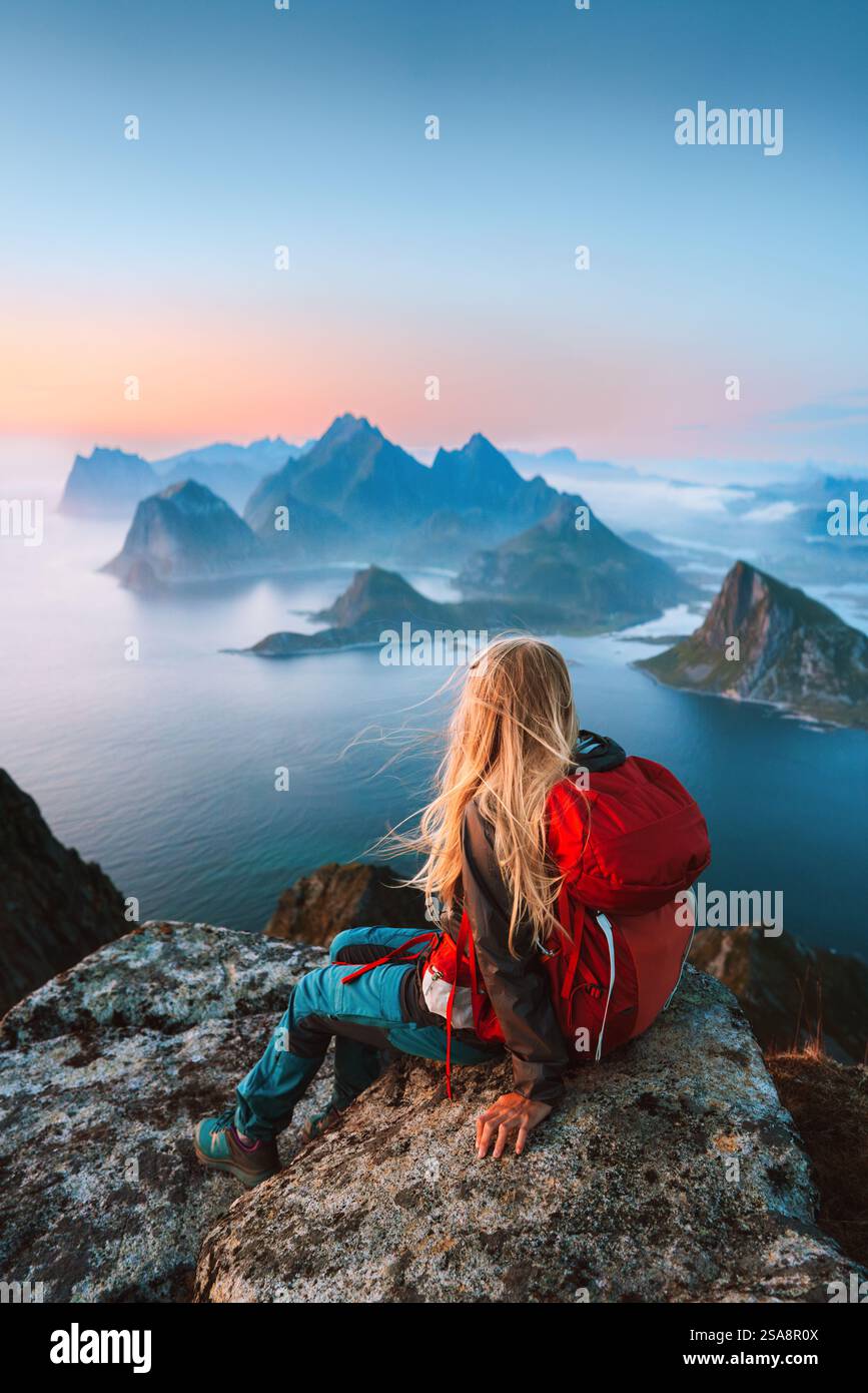 Woman traveler hiking in Norway girl backpacker relaxing on mountain ...