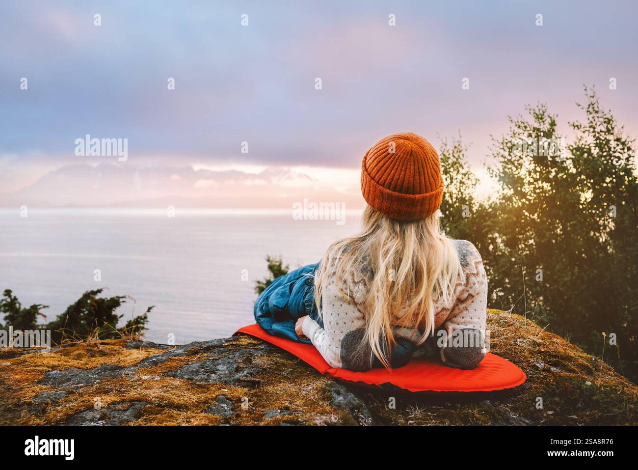 Camping outdoor woman relaxing on sleeping pad bivouac gear travel ...