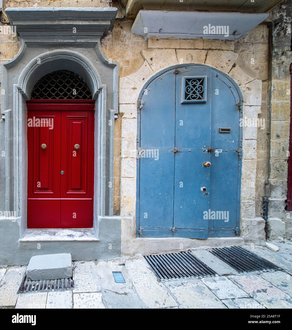 Traditional house detail in Malta. Limestone yellow bricks and colorful ...
