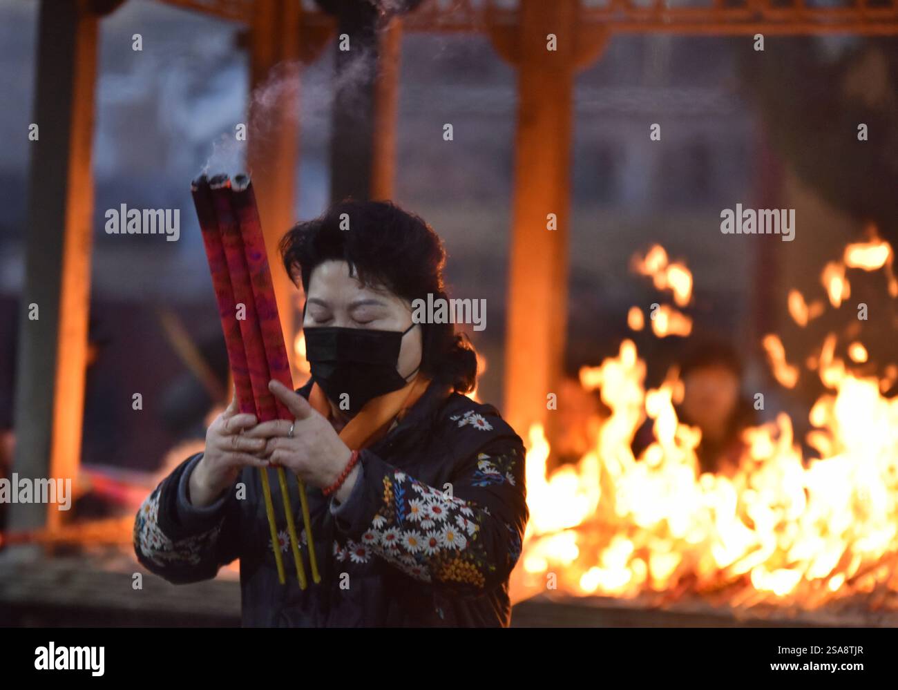 FUYANG, CHINA - JANUARY 29, 2025 - People offer incense and pray at ...