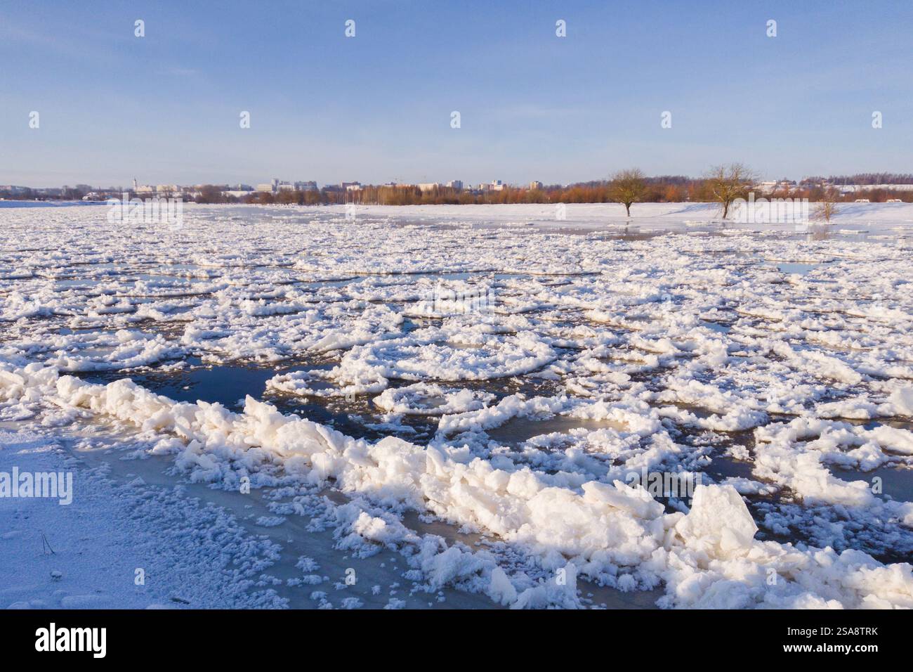 A lot of round ice is floating along the shore. Ice drift, melting ice ...