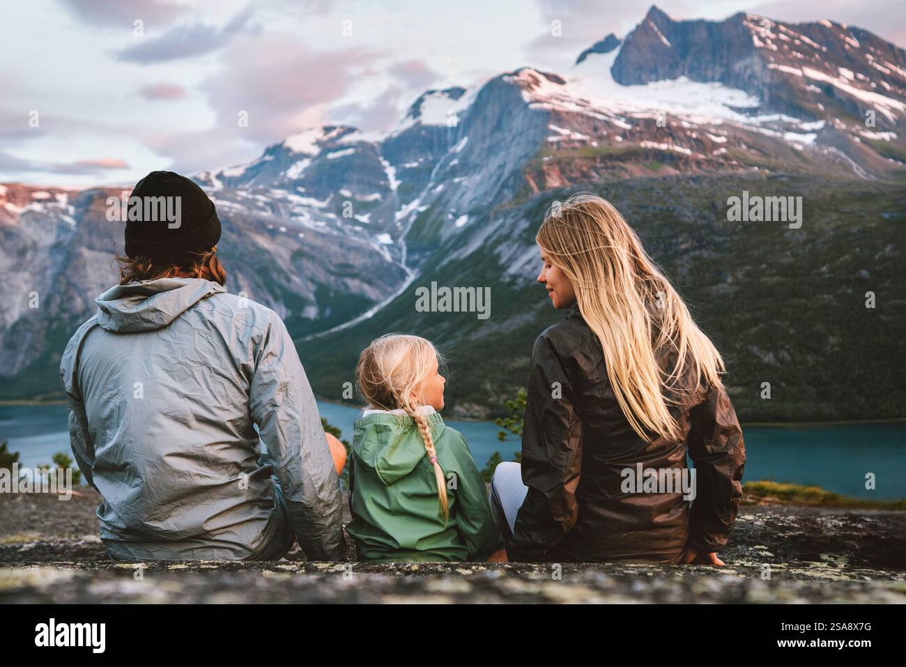 Family traveling together in Norway outdoor mother, father and child on ...