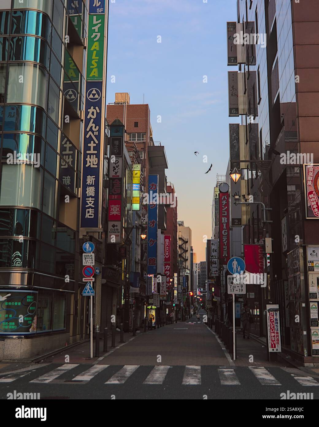 Early morning view looking down a long and narrow street in central ...