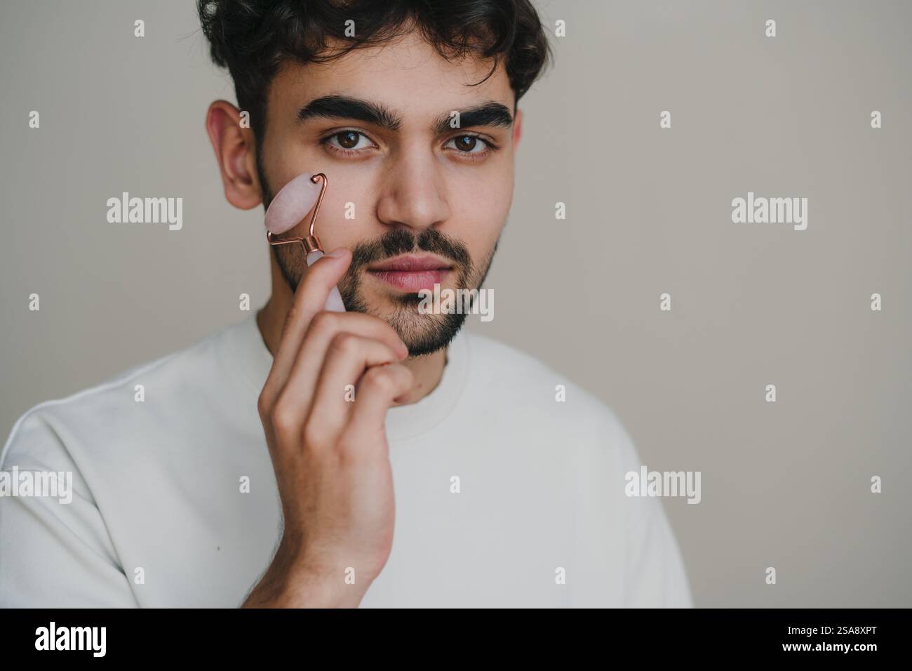 A Young Man, accompanied by a Pink Bird, poses for a captivating and ...