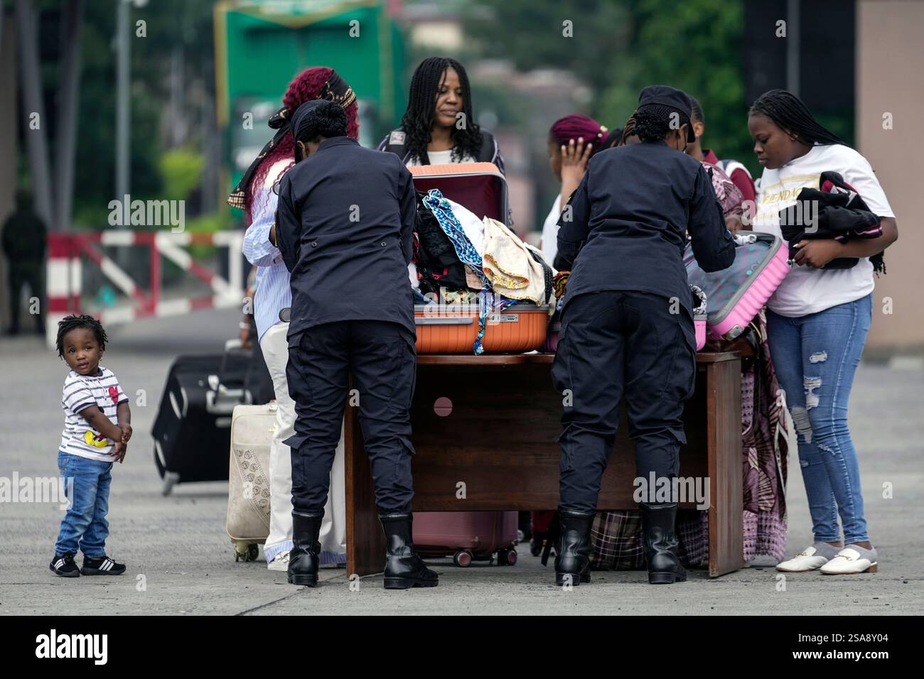 Rwanda security officials check people crossing from Congo in Gisenyi ...
