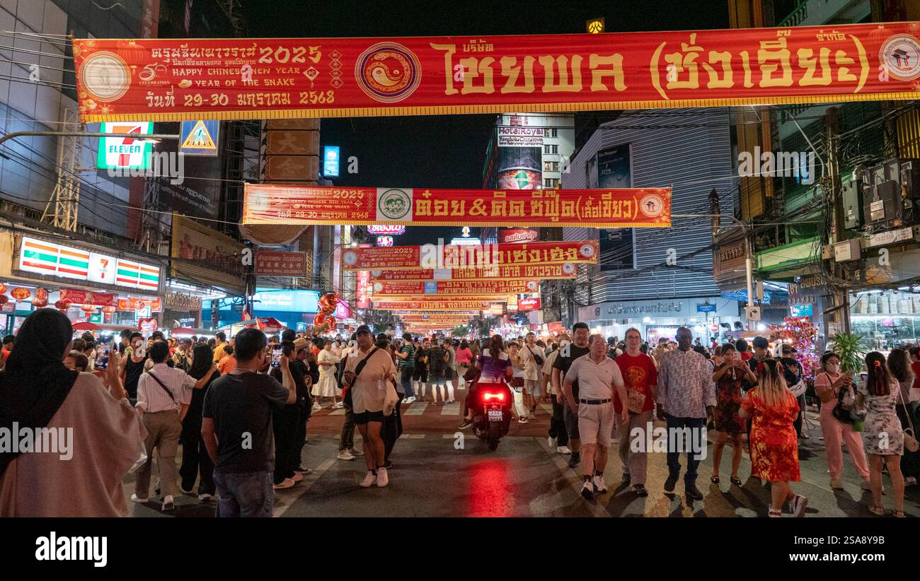 Crowds gather on Yaowarat Road in Chinatown on Lunar New Years Eve in Bangkok, Thailand. Chinese ...