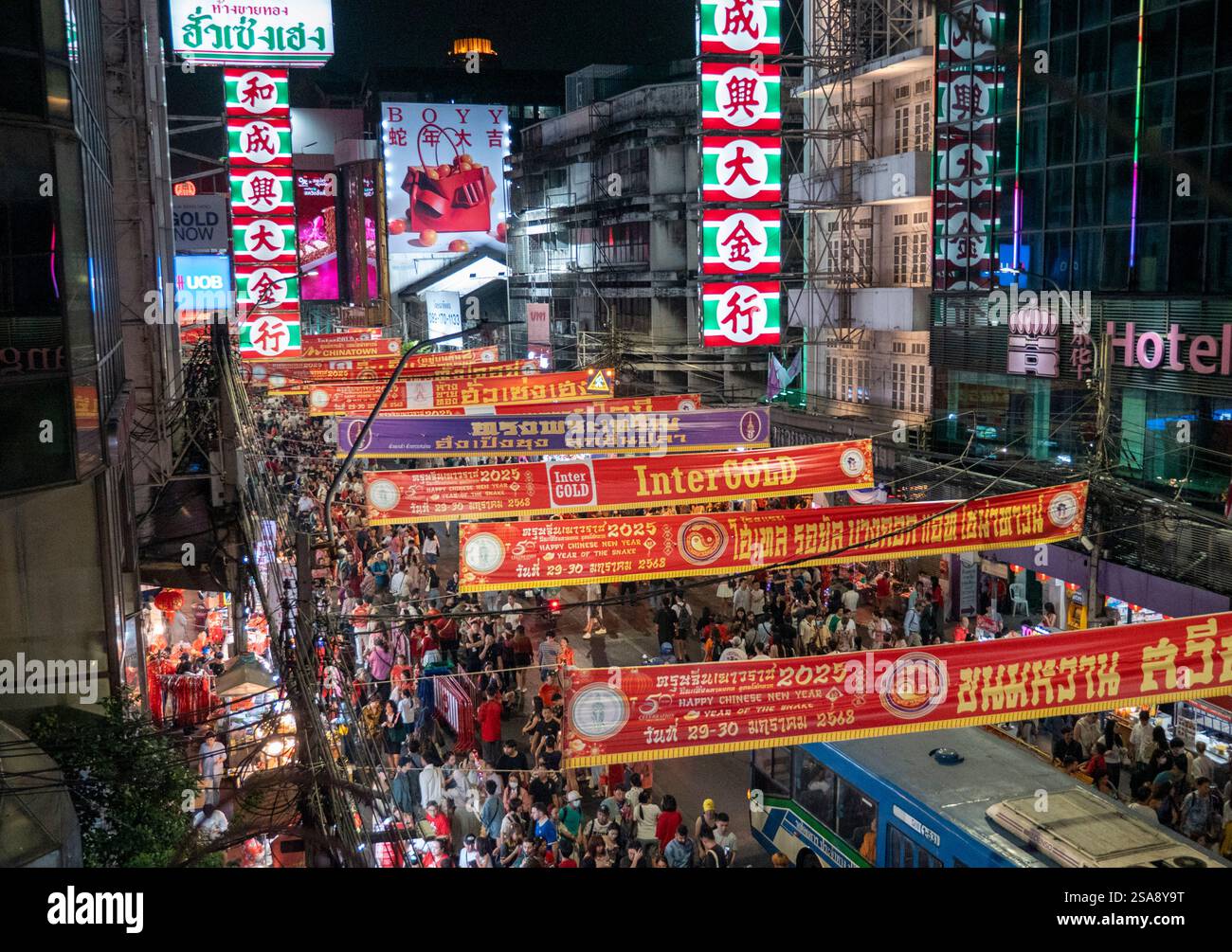 Crowds gather on Yaowarat Road in Chinatown on Lunar New Years Eve in Bangkok, Thailand. Chinese ...