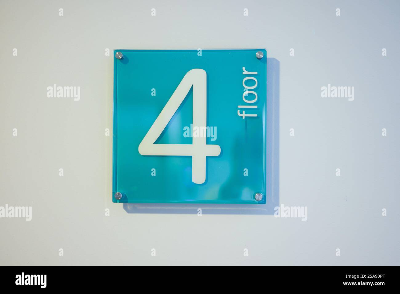 Sign on wall indicating floor, 4th floor.Floor designation indicator in ...
