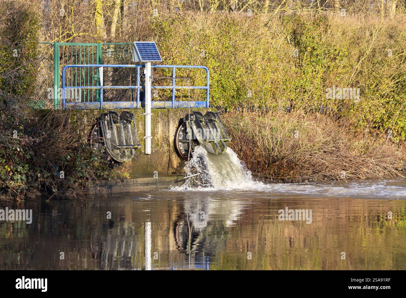 Excess water pours from a stream in the River Dender near Aalst in East ...