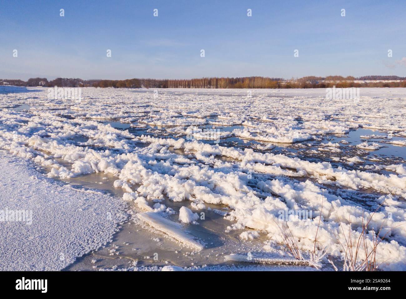 A lot of round ice is floating along the shore. Ice drift, melting ice ...