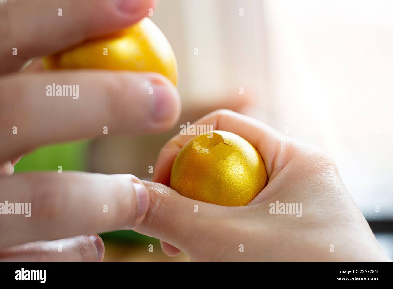 Egg cracked in an Orthodox Easter traditional custom Stock Photo - Alamy