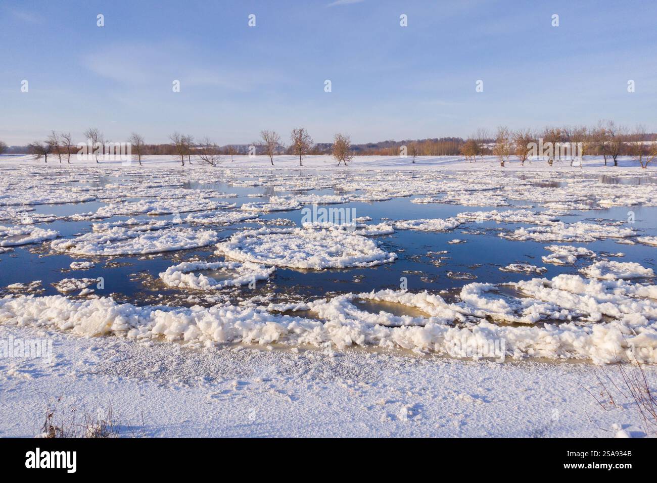 A lot of round ice is floating along the shore. Ice drift, melting ice ...