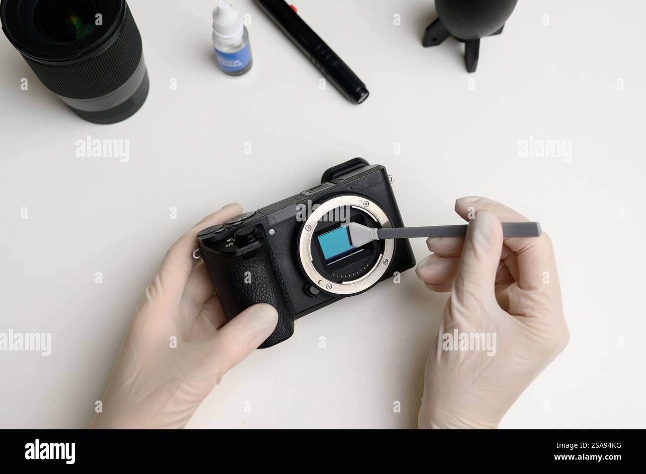 Cleaning the camera sensor cleaning swab to clean the sensor from dirt.Cleaning and maintenance ...