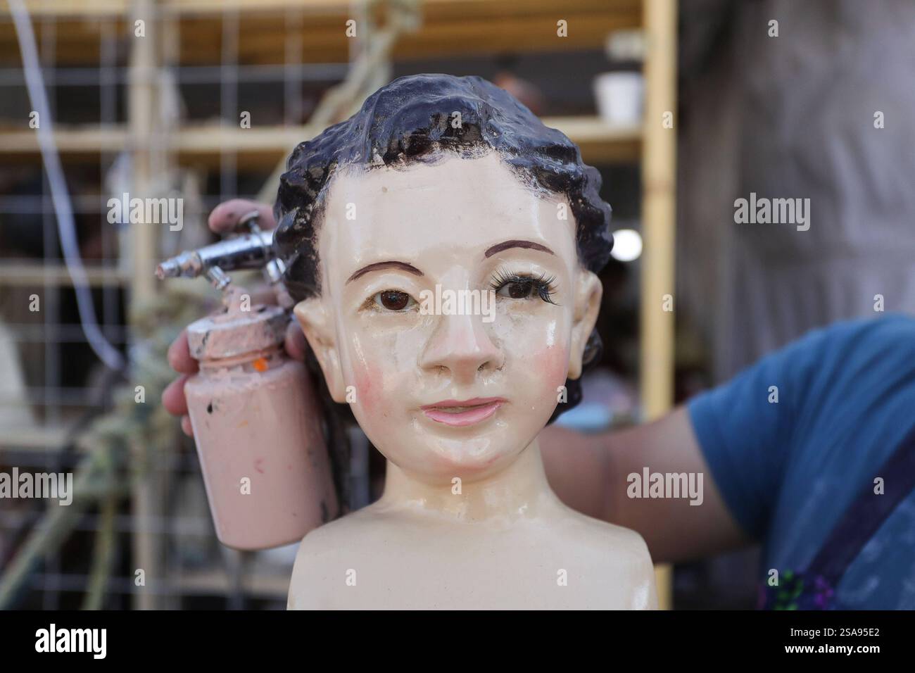 Child God Repair For Candlemas Celebrations An artisan repairs a ...