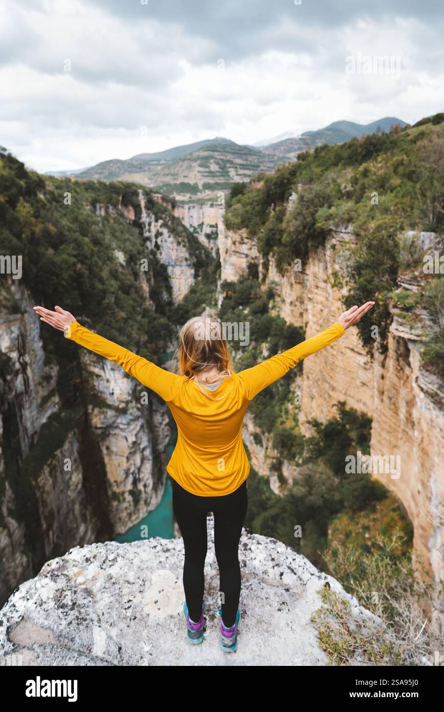 Woman on cliff traveling in Albania, hiking solo in mountains healthy ...