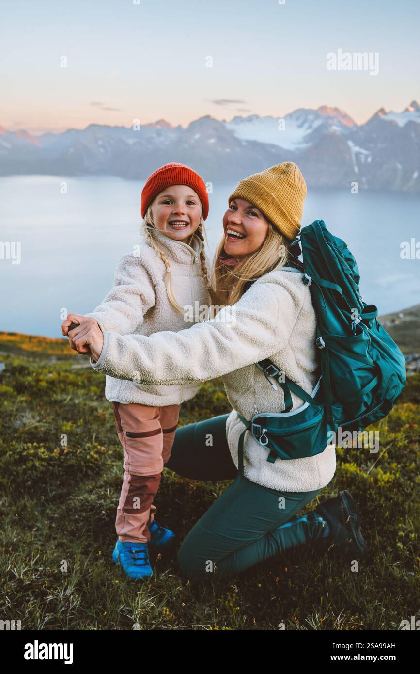 Mother playing with child in mountains family mom and daughter having ...