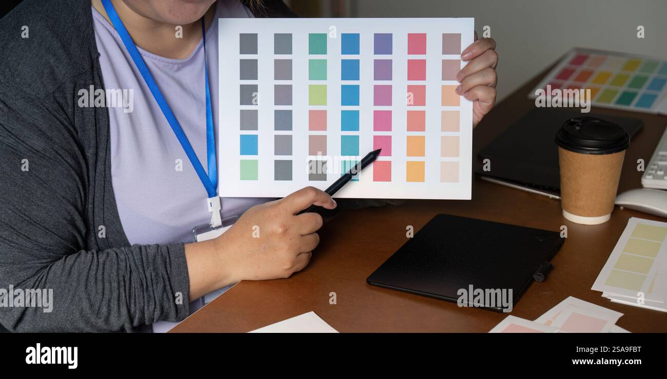 Graphic designer showcasing a vibrant color palette for creative ...