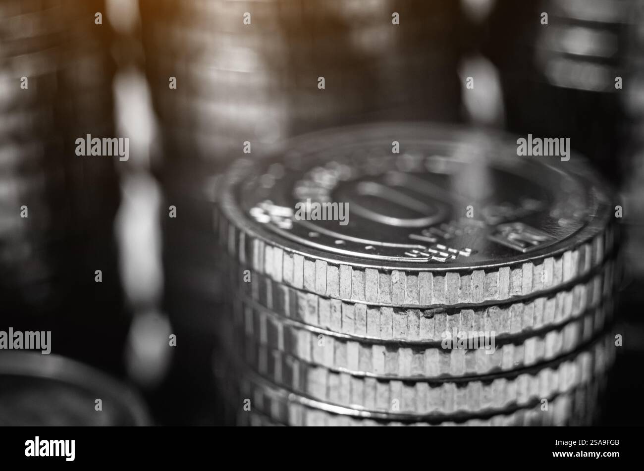 Side view of stack of coins close-up, texture of edges of coin. Silver ...