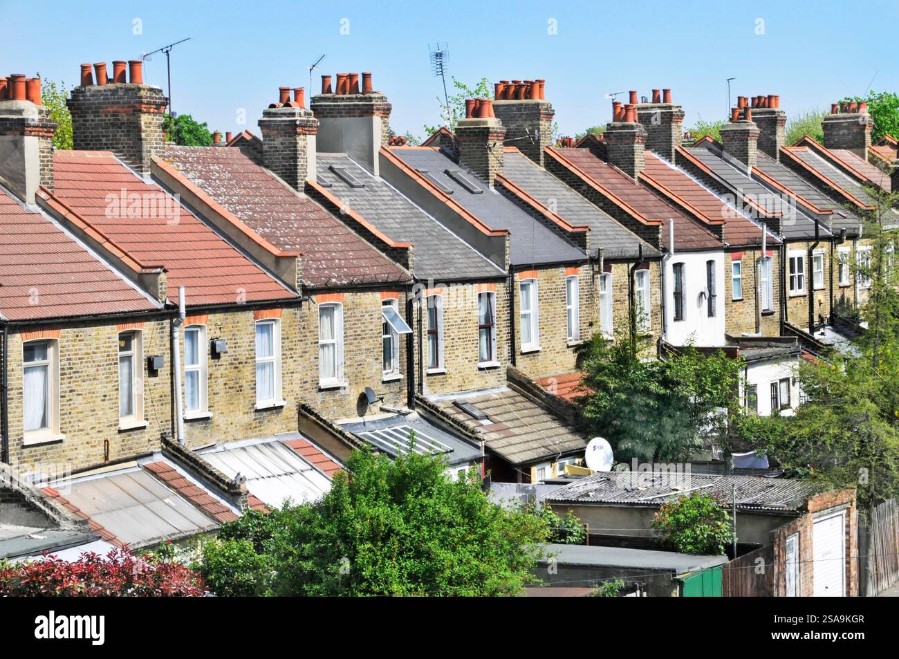 Back gardens view long row terraced houses repetitive line of brick ...