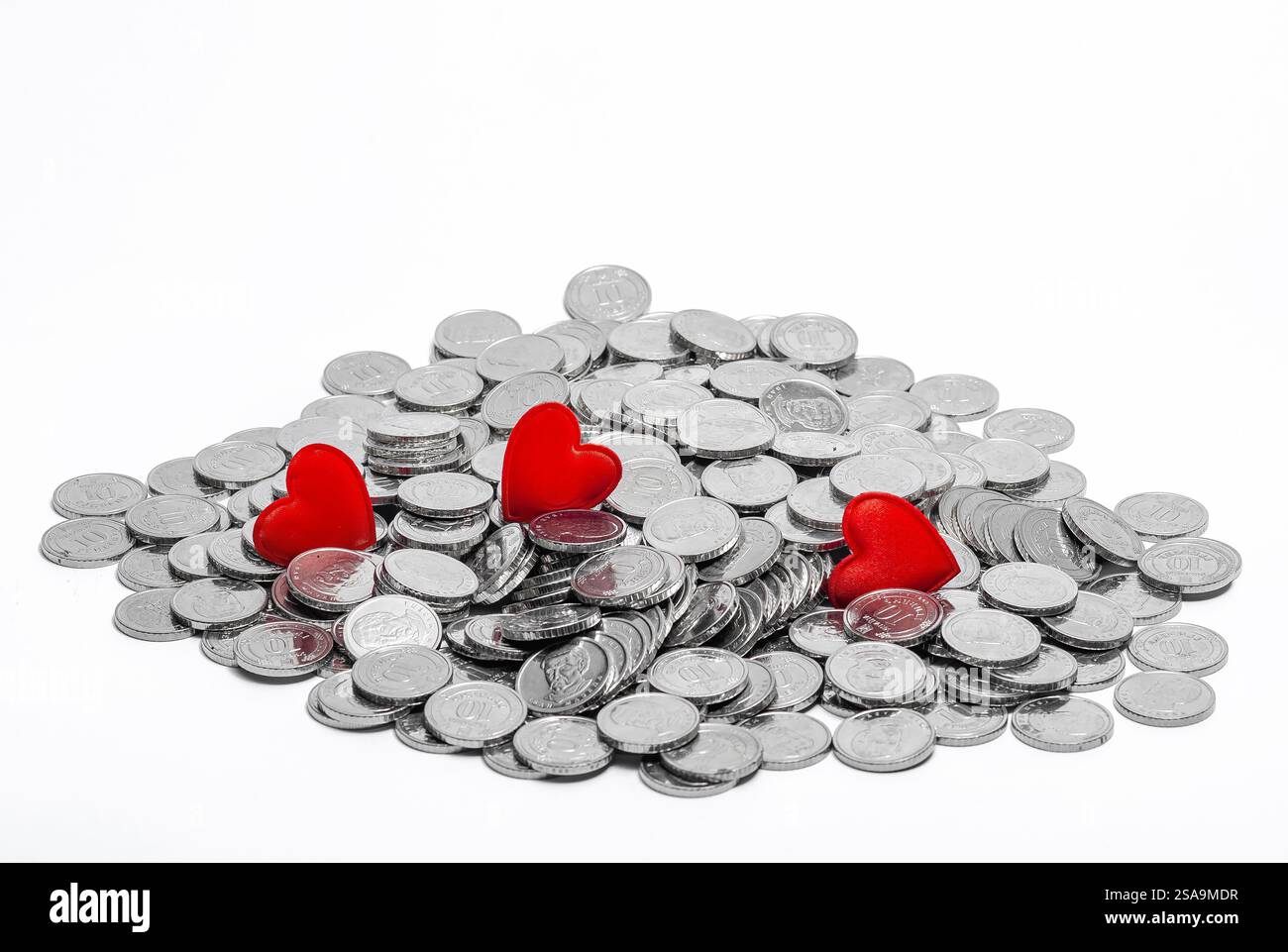 Three red hearts on silver coins, isolated on white. Idea for design ...