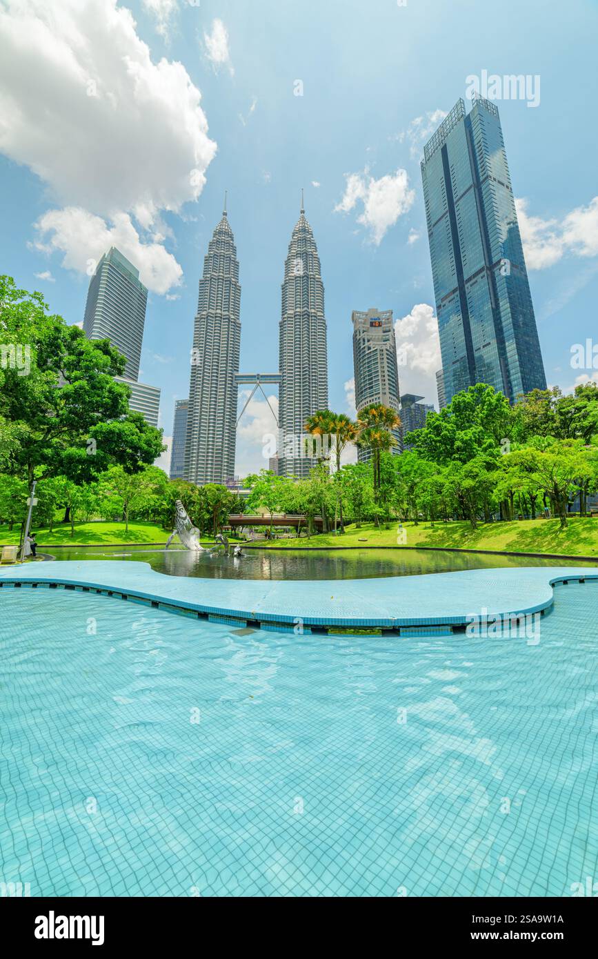 Outdoor swimming pool at the KLCC Park and skyscrapers Stock Photo - Alamy
