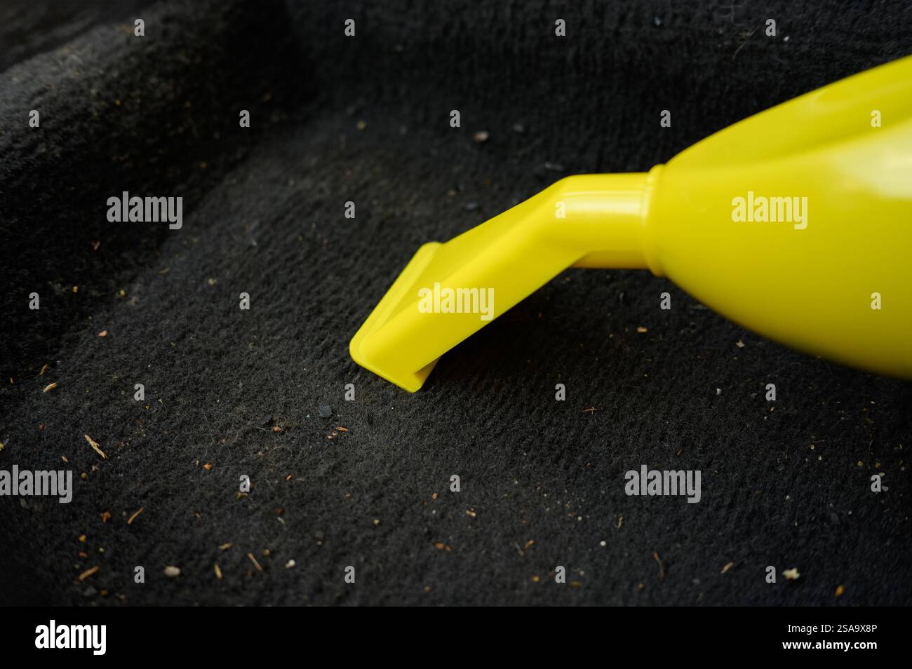 Cleaning a car showroom with a vacuum cleaner, cleaning textiles on the ...