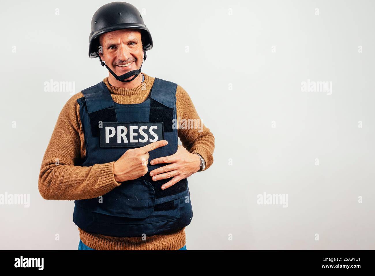 Reporter with bulletproof vest on white background Stock Photo - Alamy