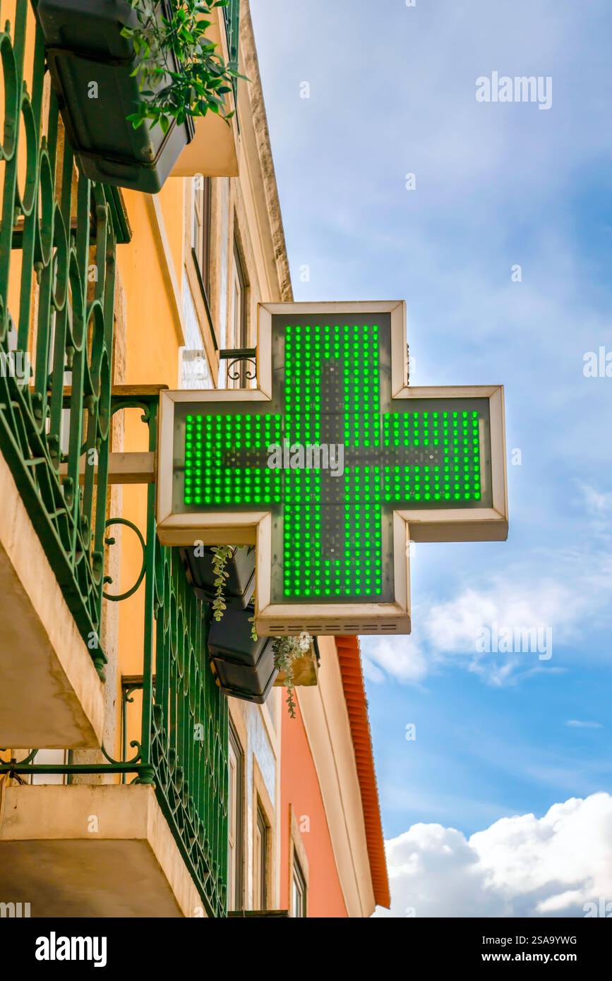 Green Cross Sign Pharmacy. Sign of pharmacy on facade of building in ...