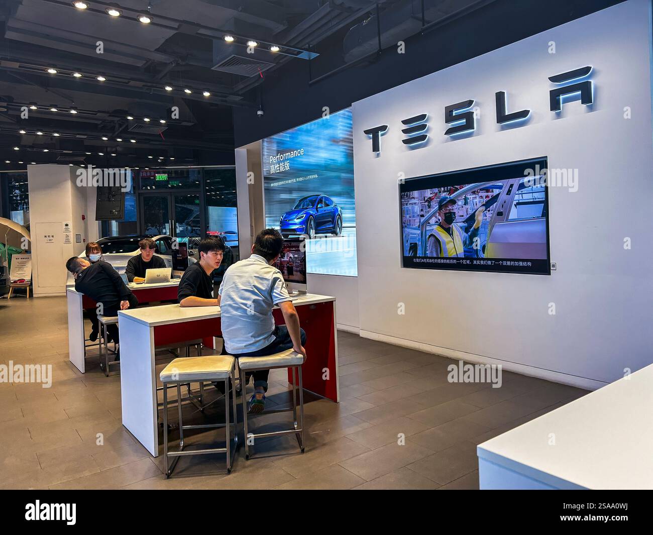 Shanghai, China, Salesmen sitting, Wide Angle View, Inside "Tesla ...