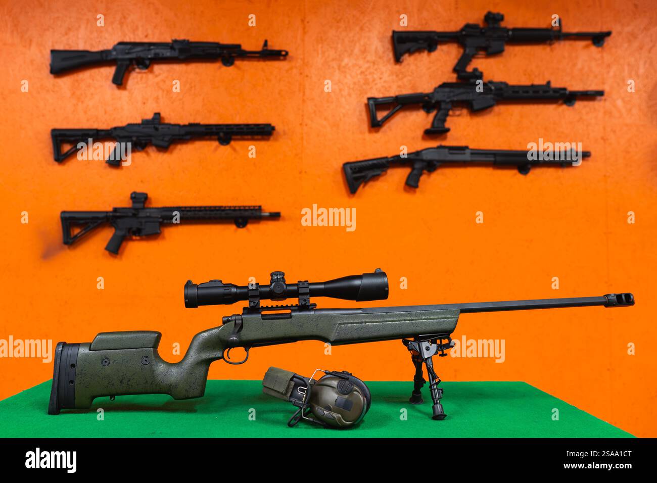 An American sniper rifle and other weapons in a shooting range, with ...