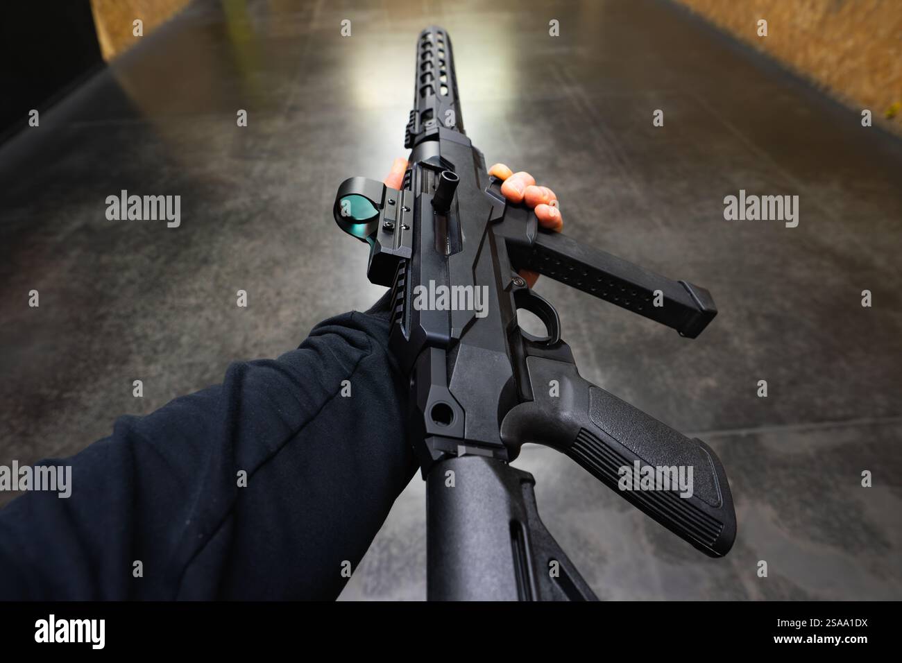 Tactical pcc rifle for 9mm pistol caliber with red dot sight in mans ...