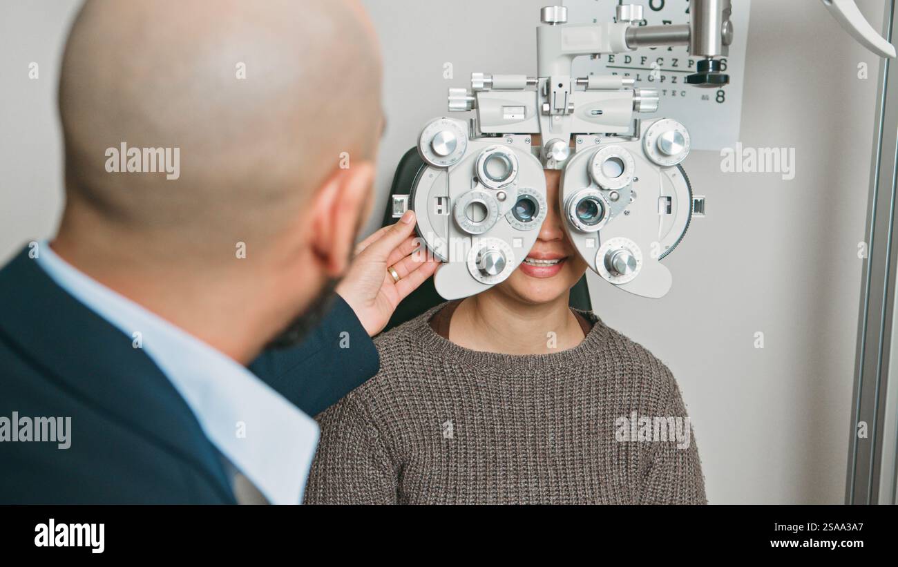Optometrist Conducting an Eye Examination Using Advanced Equipment ...