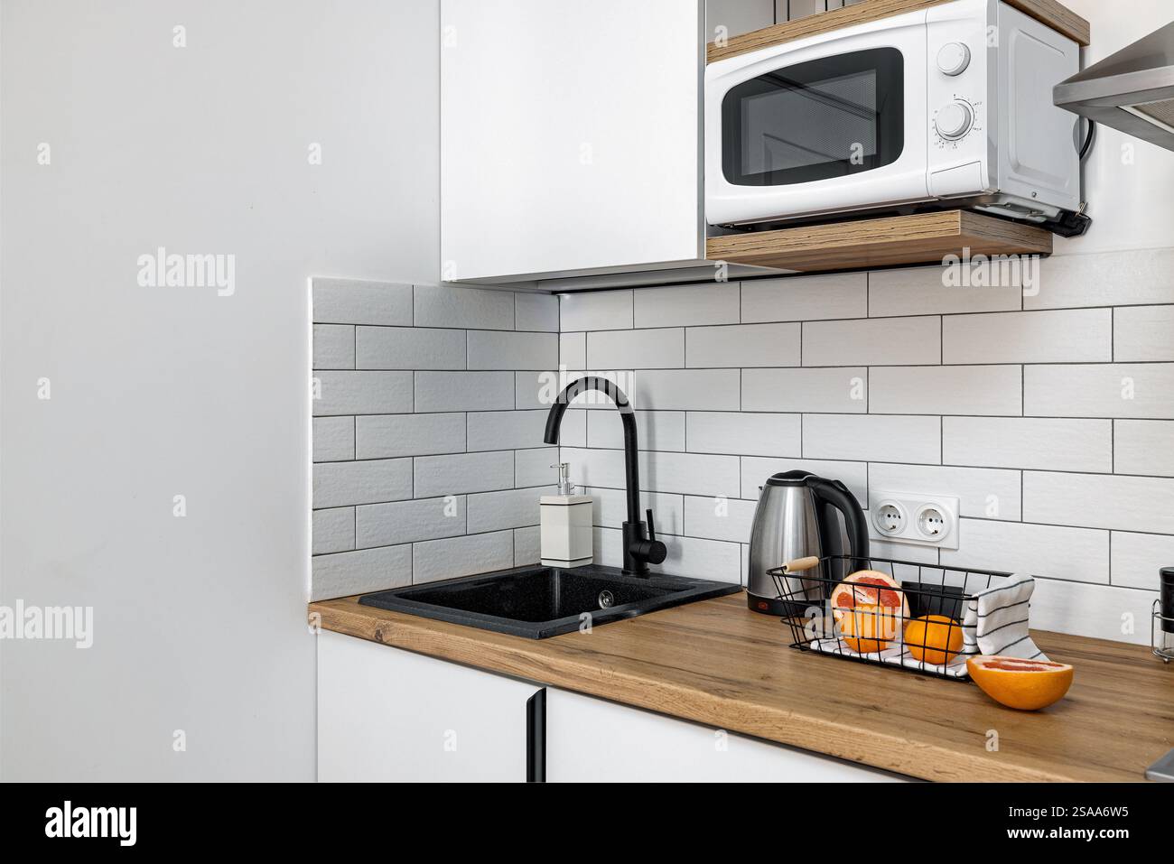A modern kitchen design that features essential appliances, stylish ...