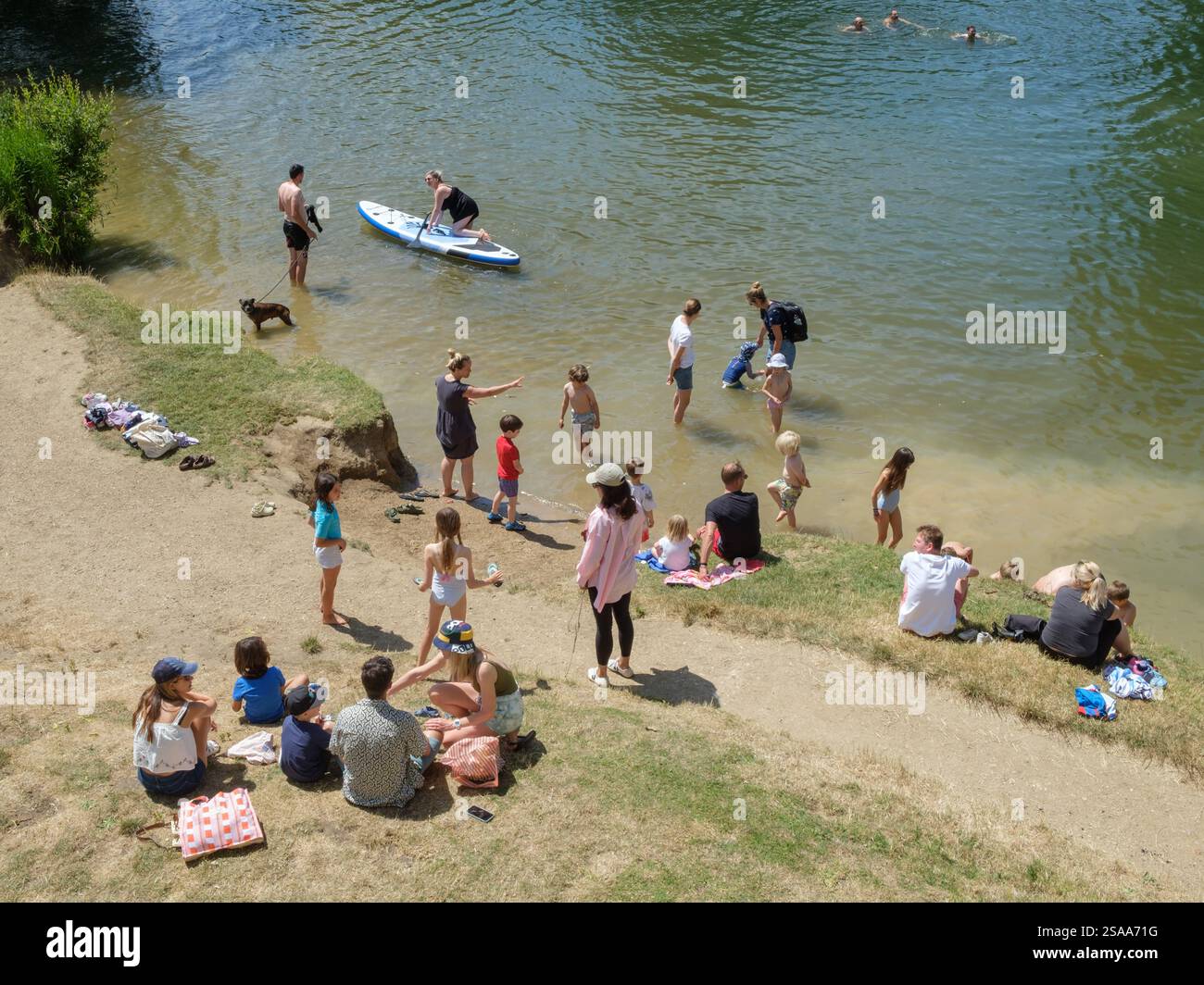 Holidaymakers at Wallingford Beach by the Thames at Wallingford on a ...