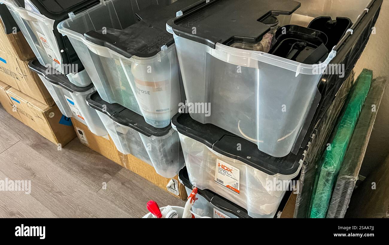 Stacked plastic storage bins for moving process Stock Photo - Alamy