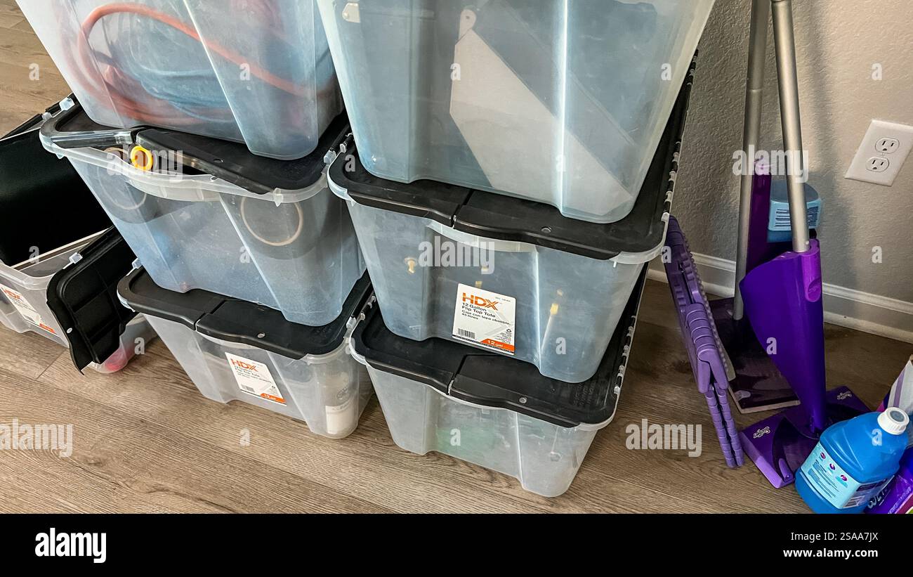 Stacked plastic storage bins for moving process Stock Photo - Alamy