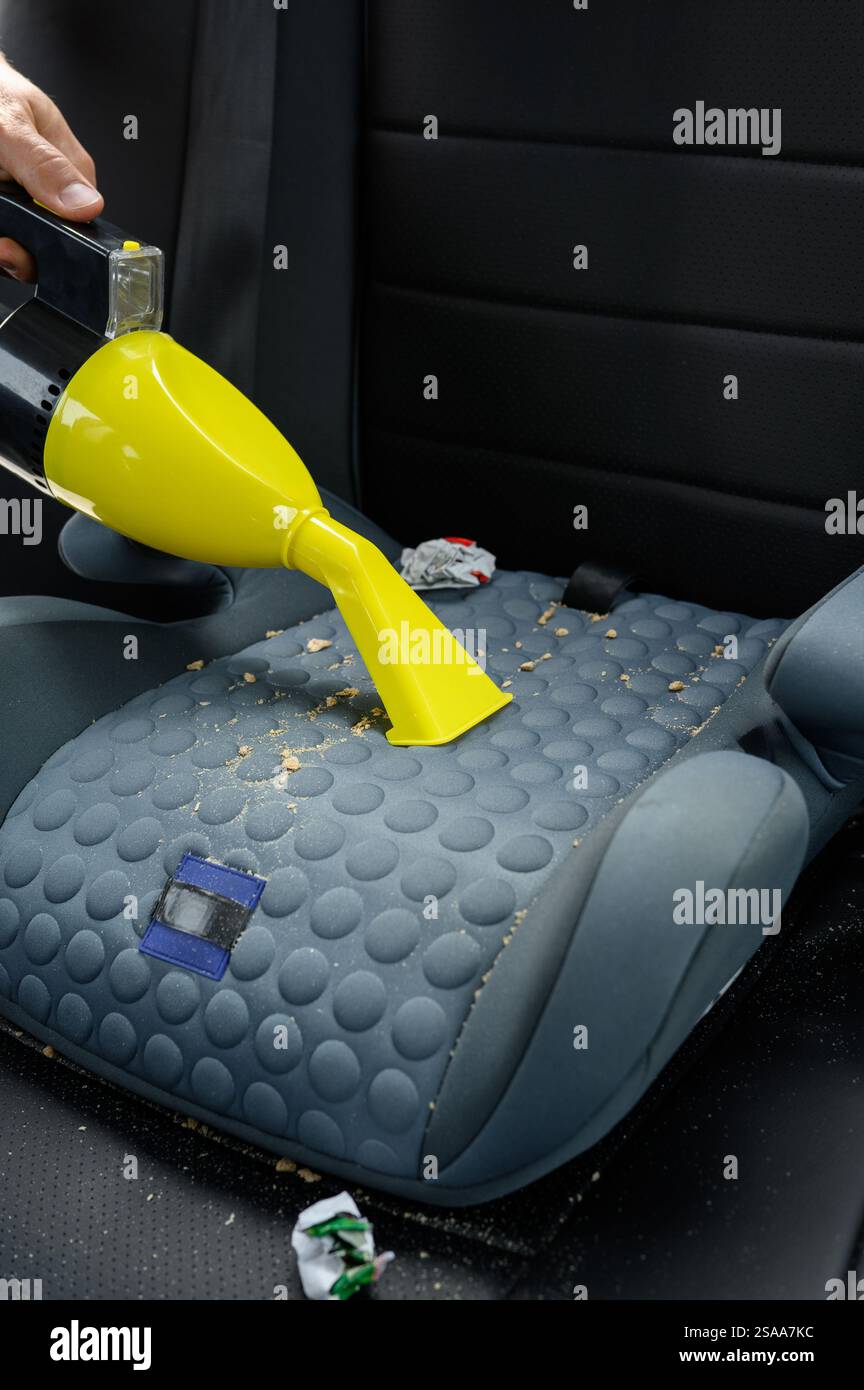 Cleaning child car seat with portable vacuum cleaner, cleaning seat ...