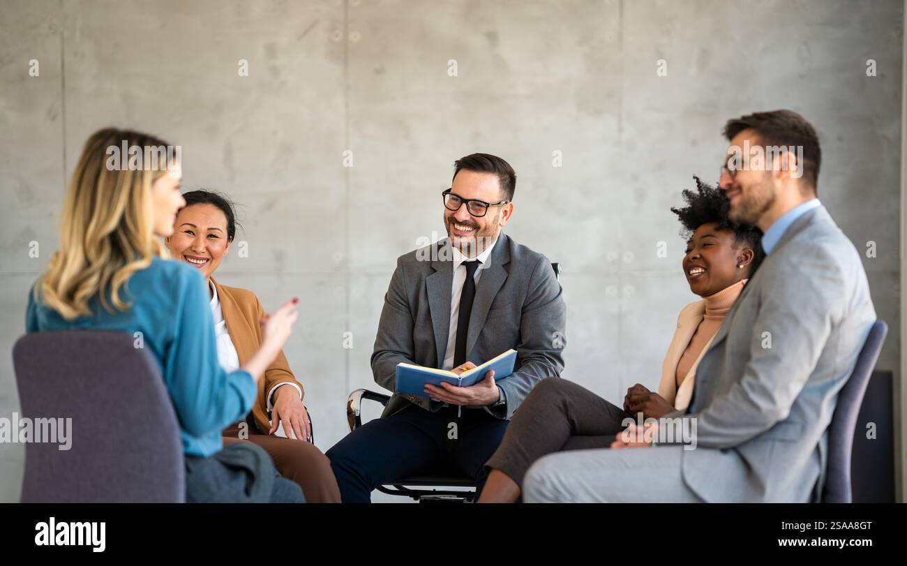 Group therapy. Multiethnic professional people sitting together while ...