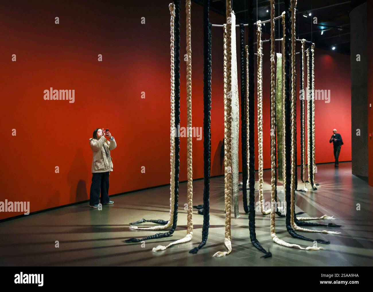 London, UK. 29th Jan, 2025. Exhibition staff and members of the press with 'Act Two', 2024 ...