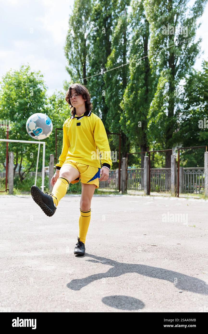 Teenage footballer practicing foot skills Stock Photo - Alamy