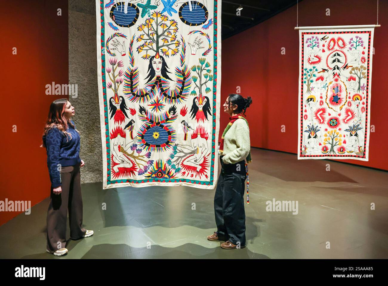 London, UK. 29th Jan, 2025. Exhibition staff and members of the press with 'Act Three', 2024 ...
