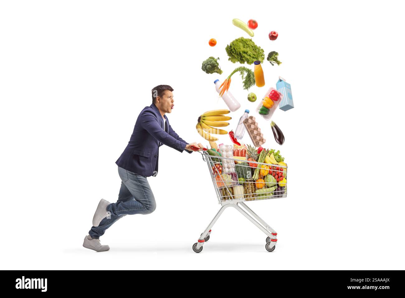 Excited man running with a supermarket shopping cart isolated on white ...